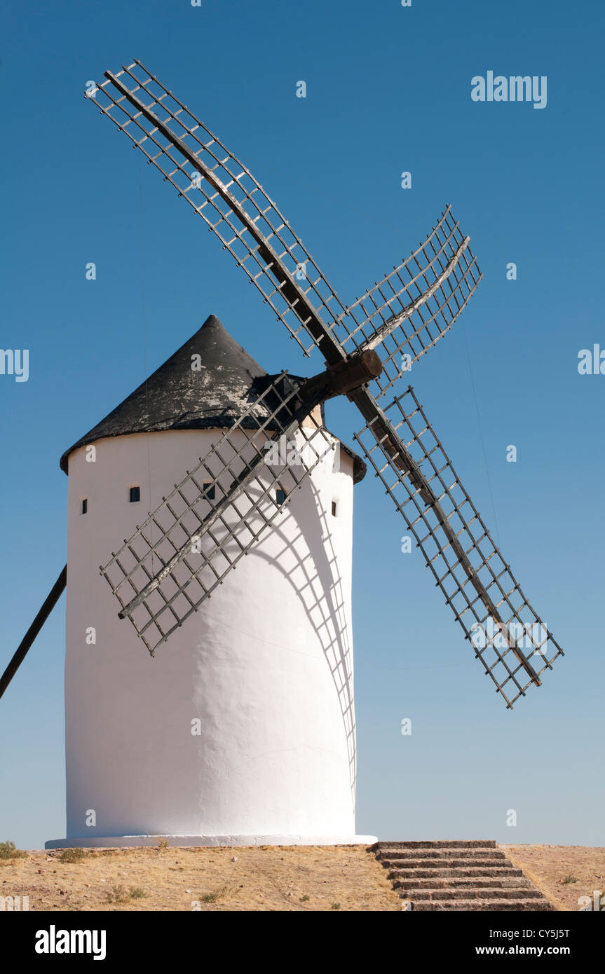 White ancient windmill. Blue sky background Stock Photo - Alamy
