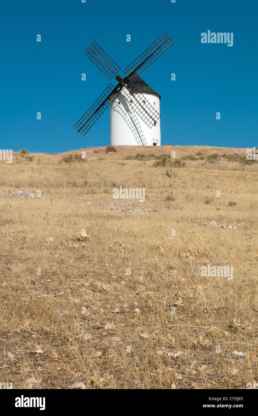 White ancient windmill. Blue sky background Stock Photo - Alamy
