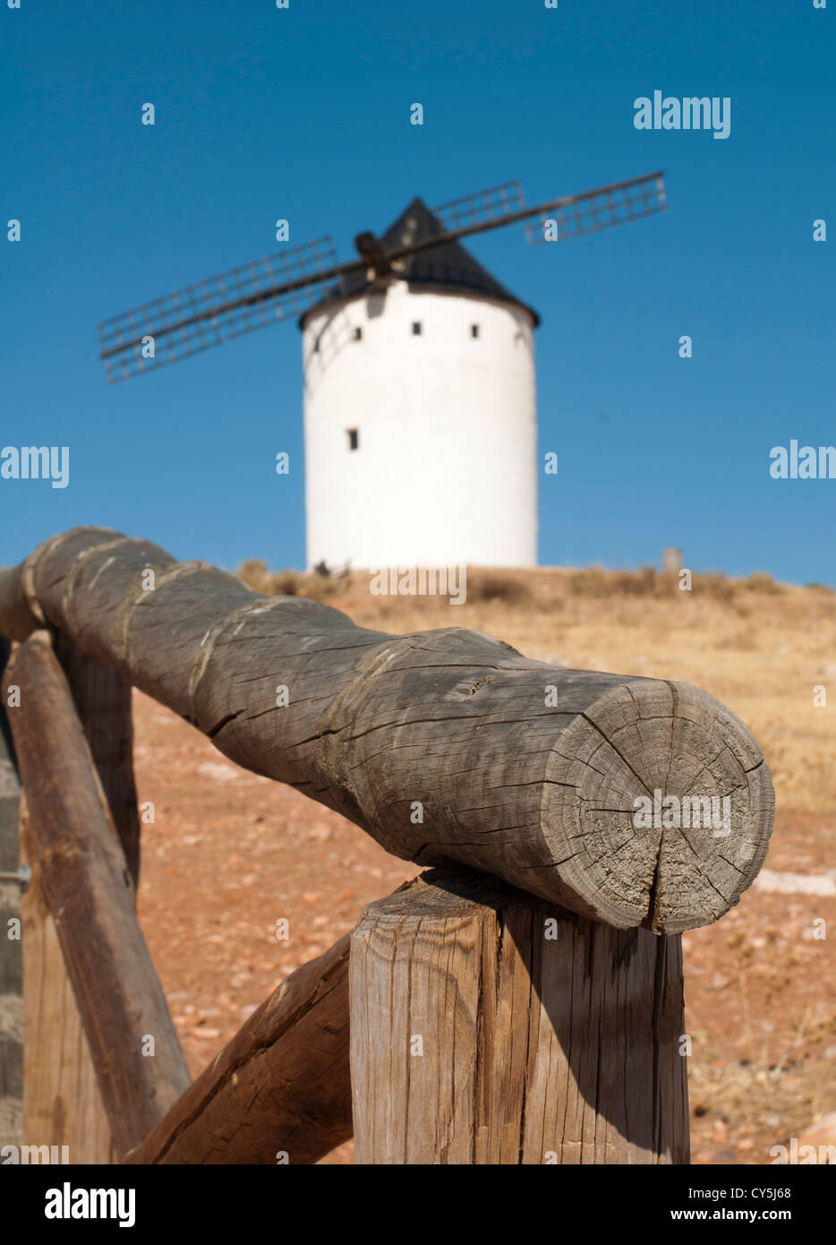 White ancient windmill. Blue sky background Stock Photo - Alamy