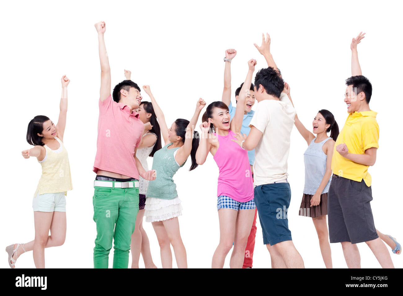 Happy young people jumping Stock Photo - Alamy