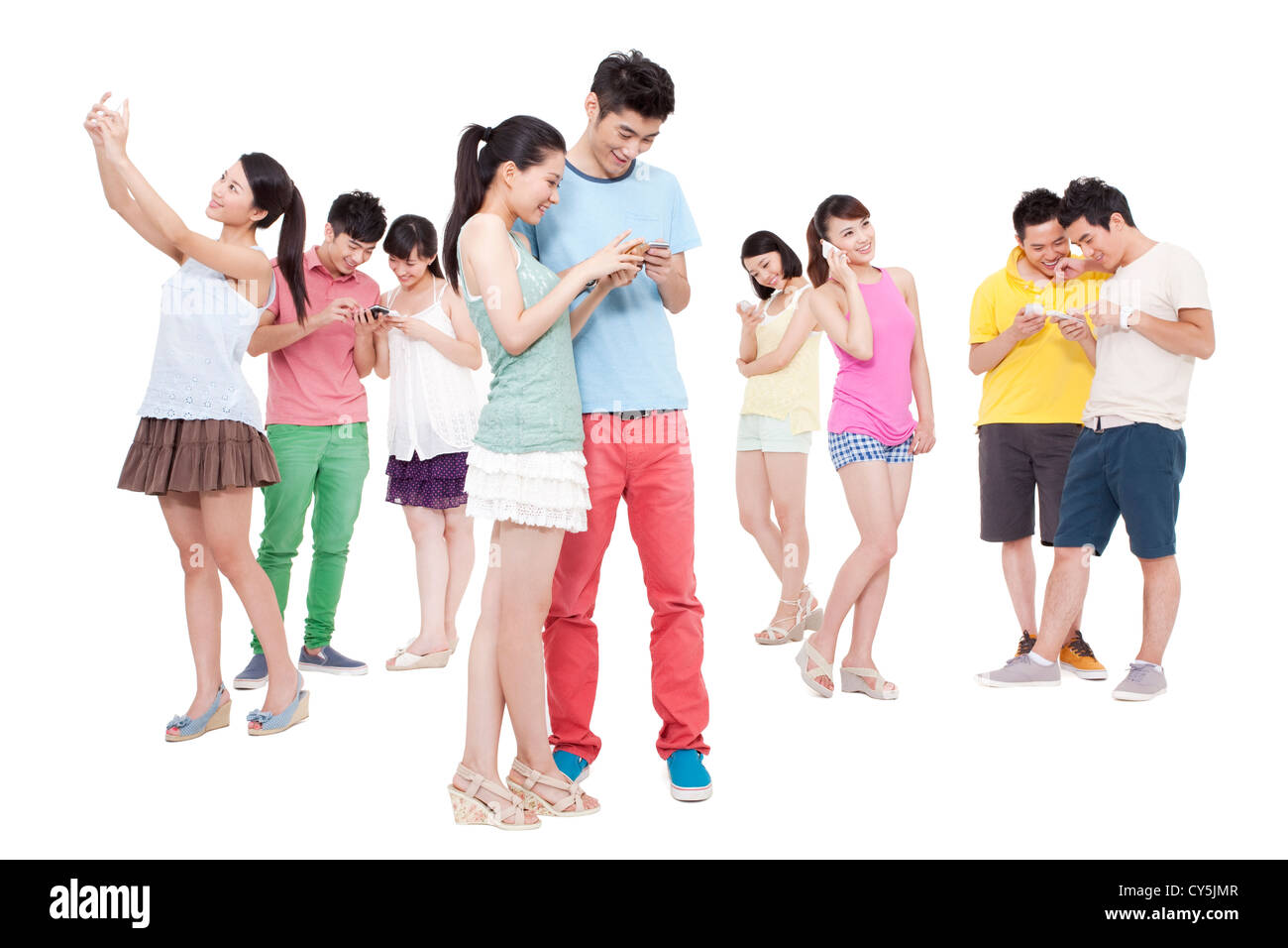 Happy young people and mobile phones Stock Photo - Alamy