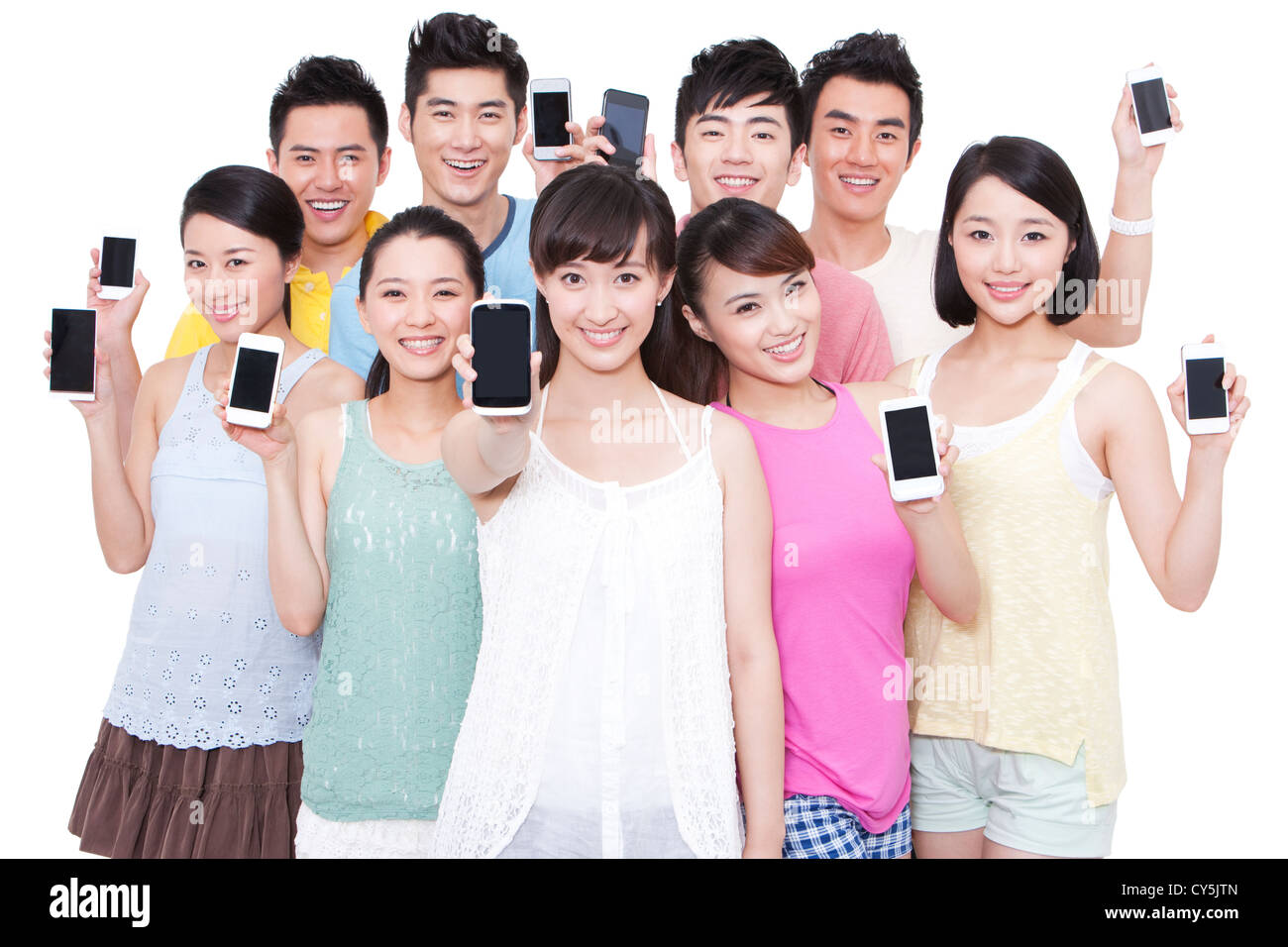 Happy young friends showing their mobile phones Stock Photo - Alamy