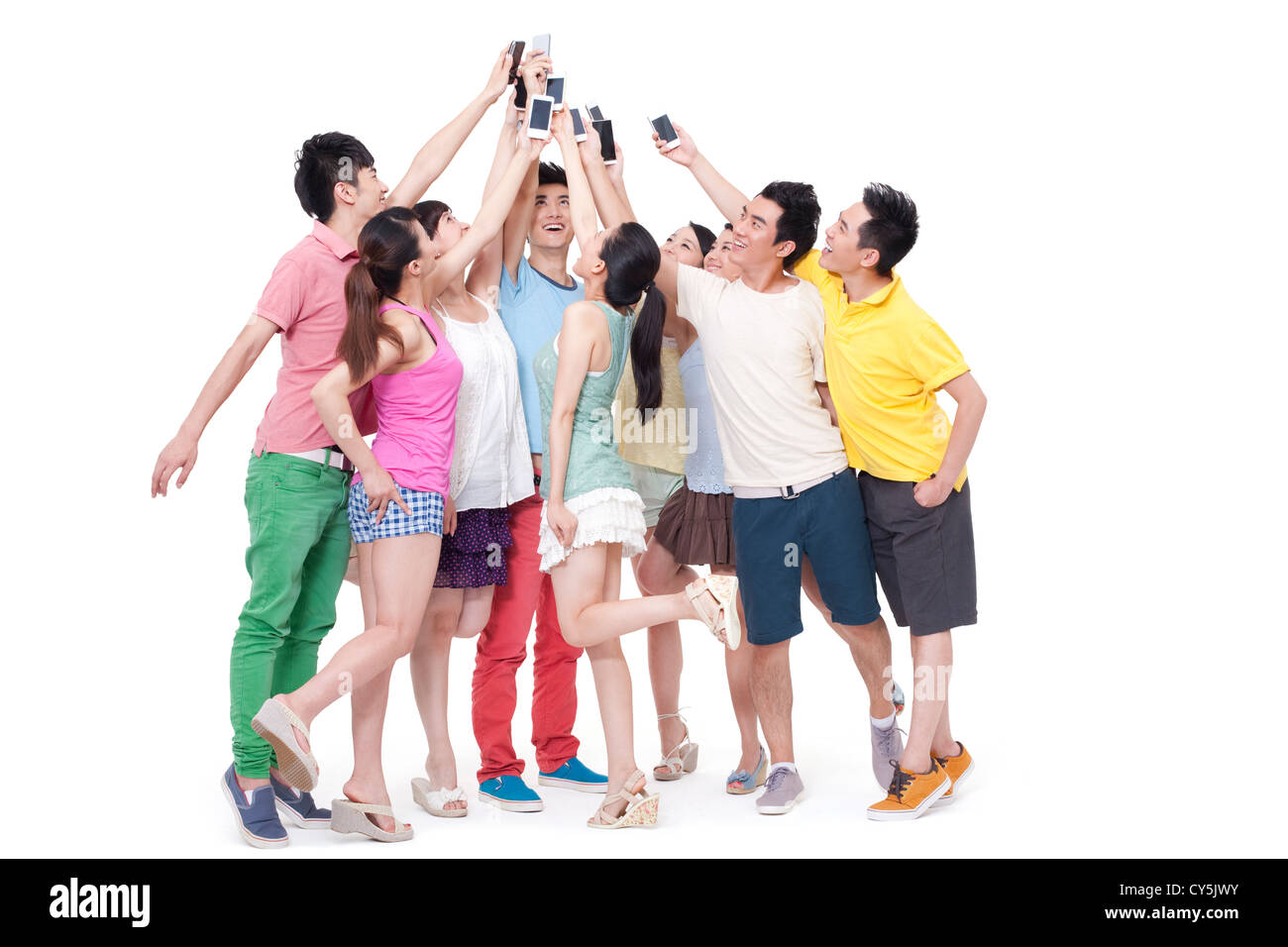 Happy young people and mobile phones Stock Photo - Alamy