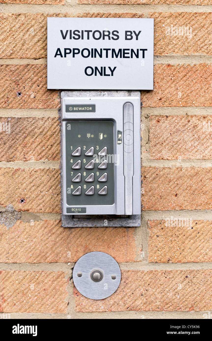 Electronic keypad lock with notice stating visitors by appointment only ...