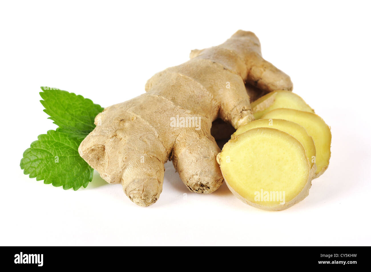Sliced ginger with leaves isolated on white background Stock Photo - Alamy
