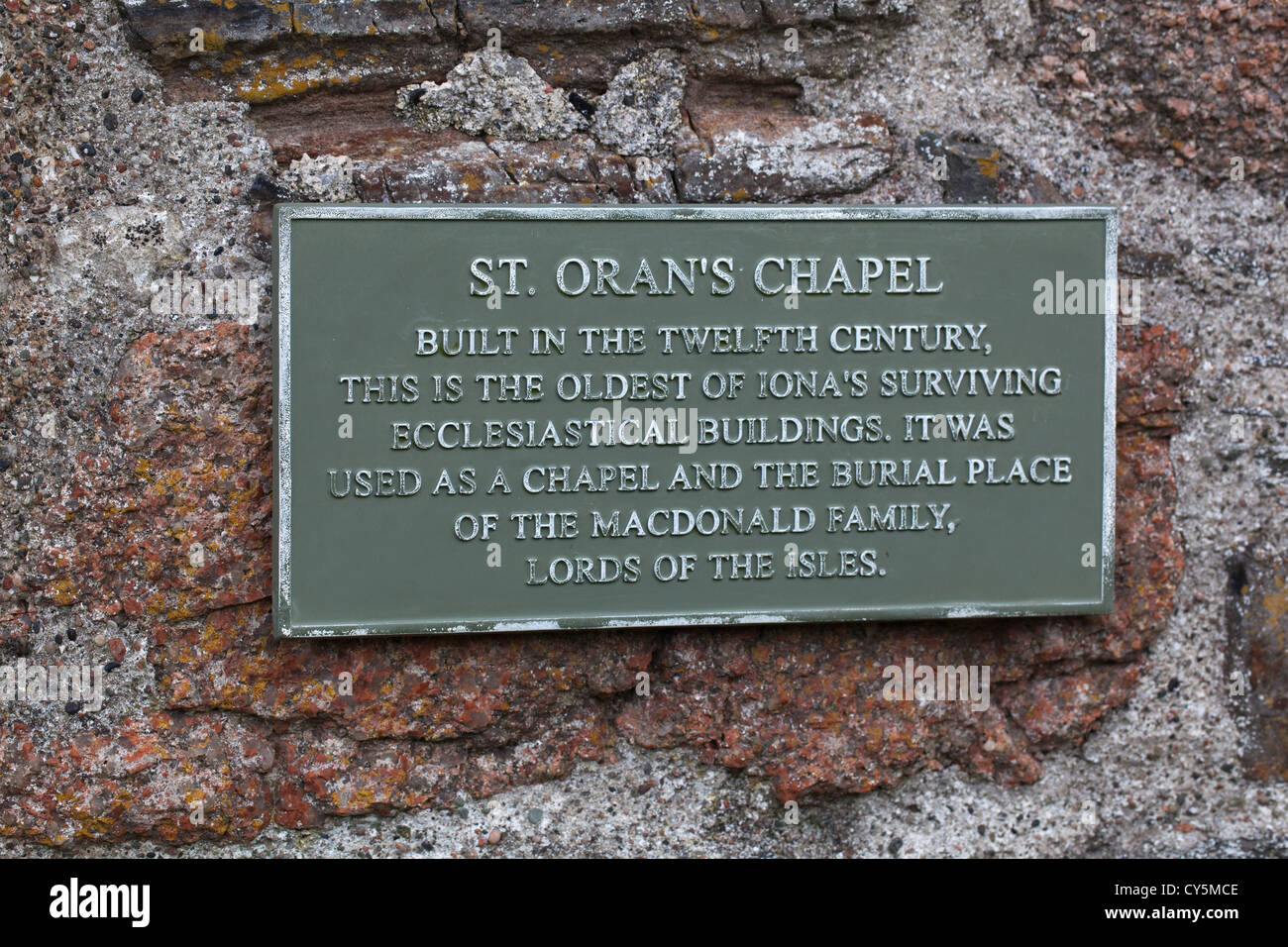 Sign. St. St. Oran's Chapel. Affixed to the exterior wall. Alongside ...