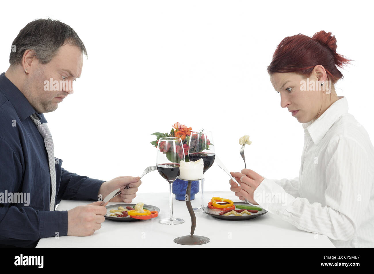 Couple eating a real bad dinner Stock Photo - Alamy