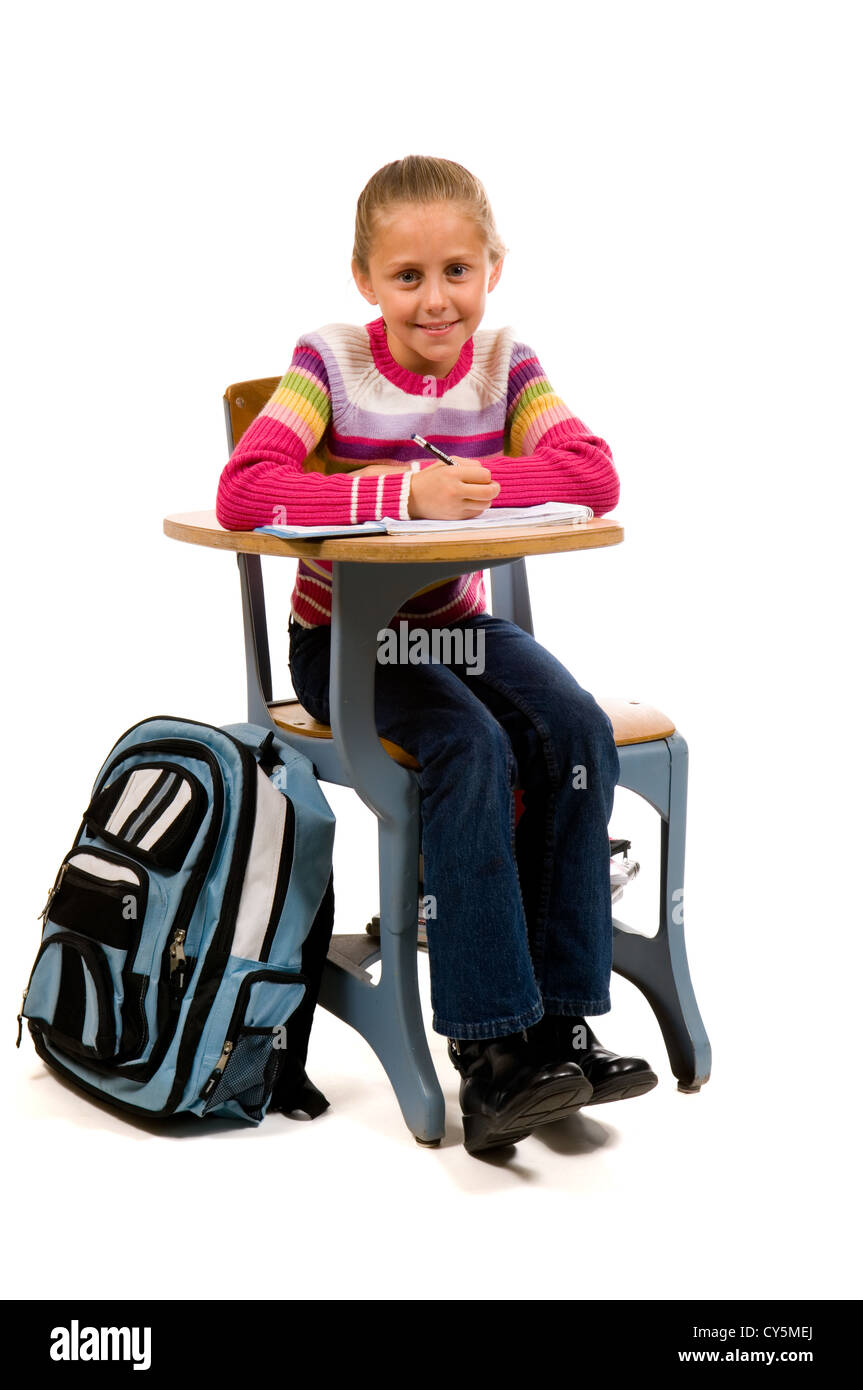young girl concentrating on work at school desk Stock Photo - Alamy