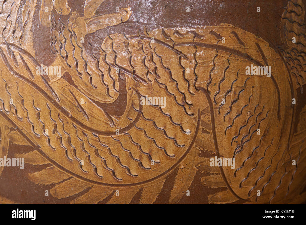 A traditional pottery design showing a dragon at Ryukyu Mura - a theme ...