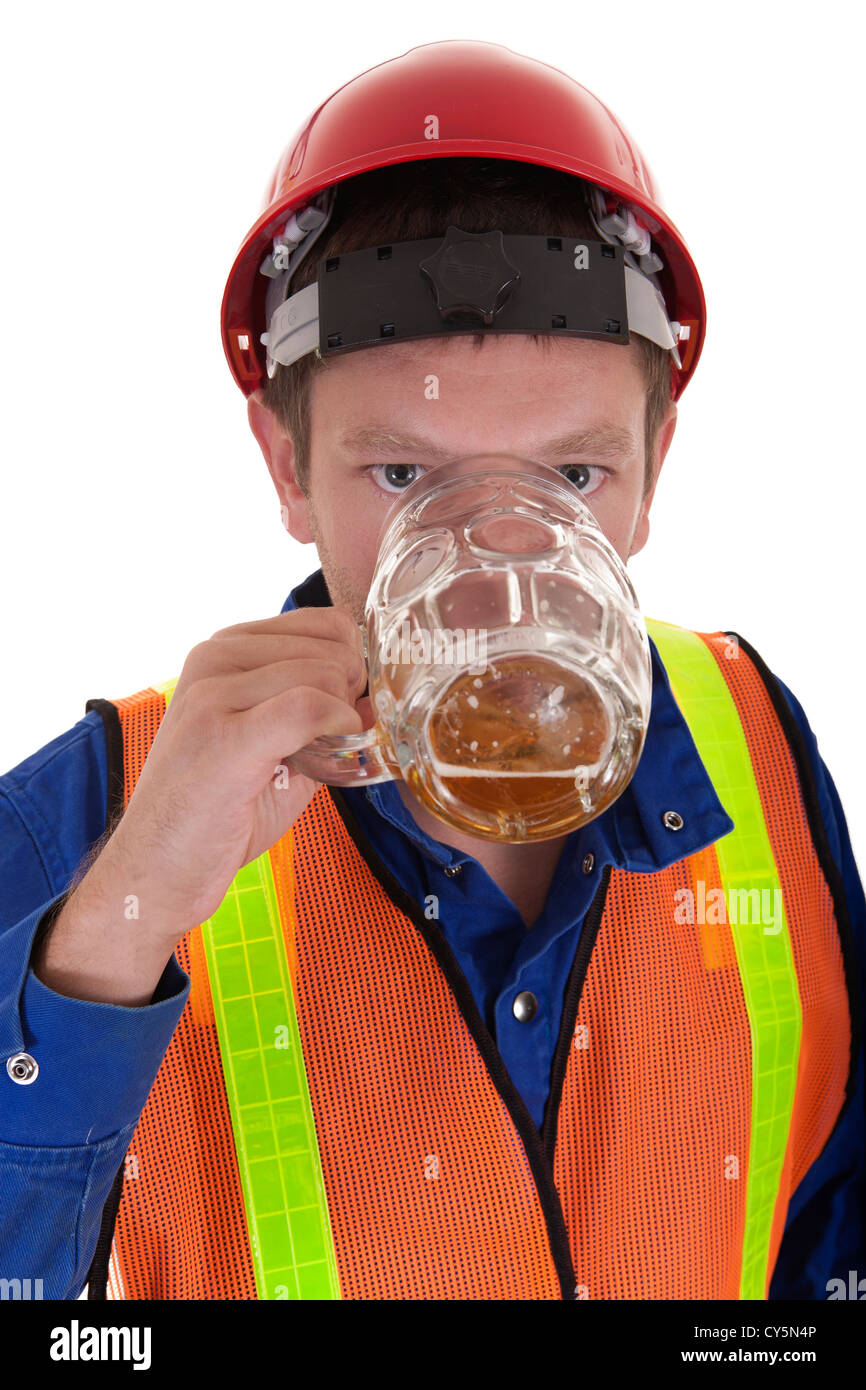 construction worker having alcoholic drink at work Stock Photo - Alamy