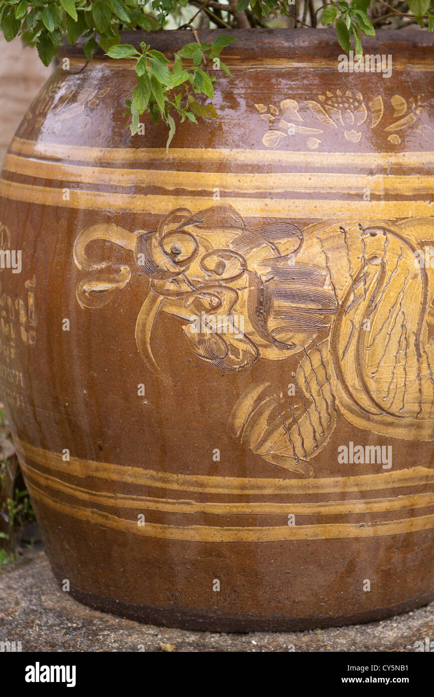 A traditional pottery design showing a dragon at Ryukyu Mura - a theme ...