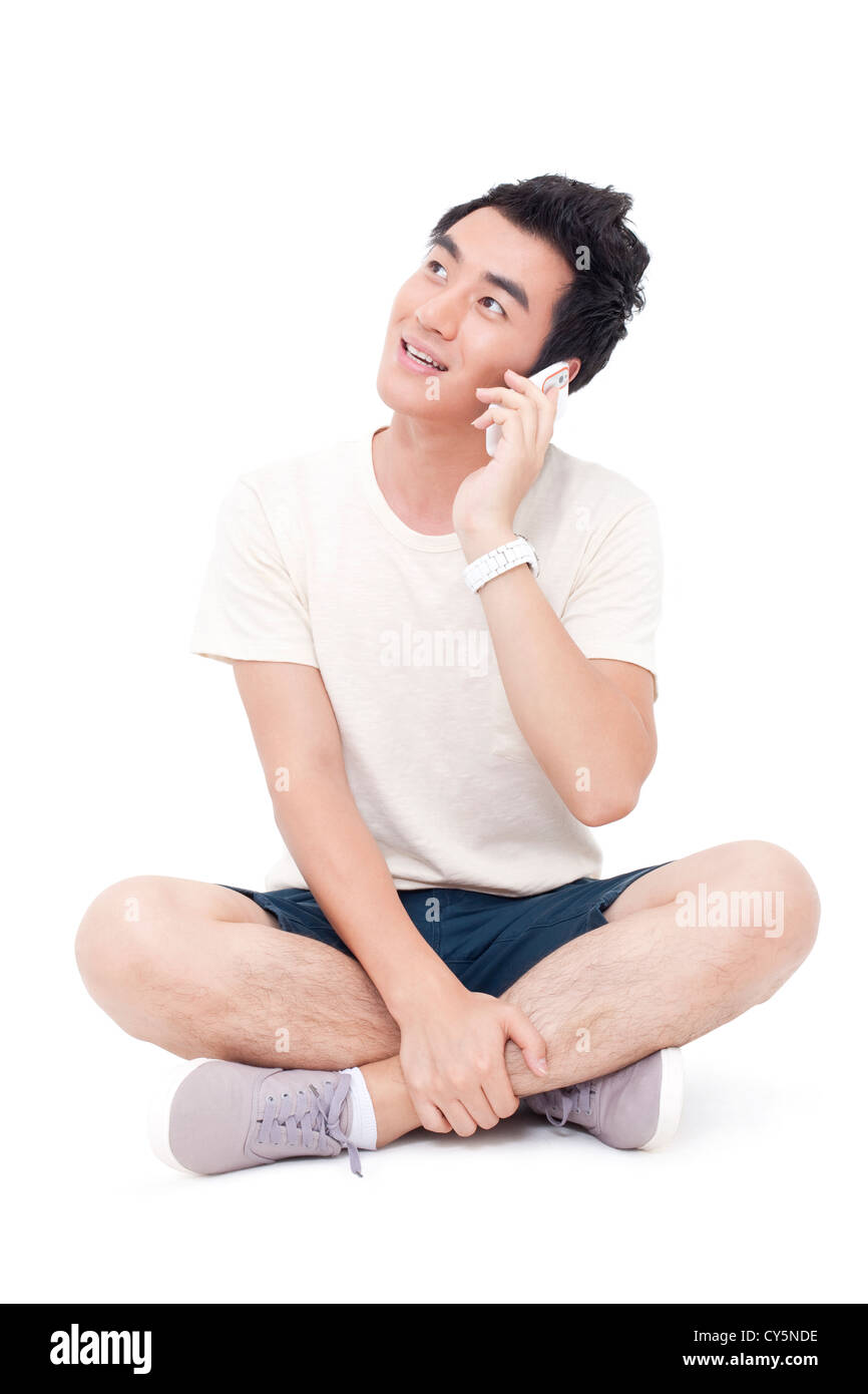 Happy young man on the phone Stock Photo - Alamy