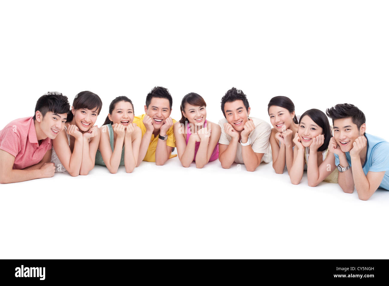 Young people lying on front in a row Stock Photo - Alamy