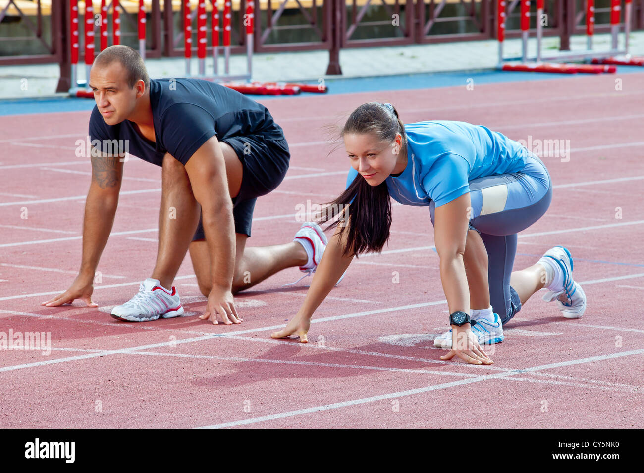 The athletes on the starting line at the stadium on a sunny day Stock ...