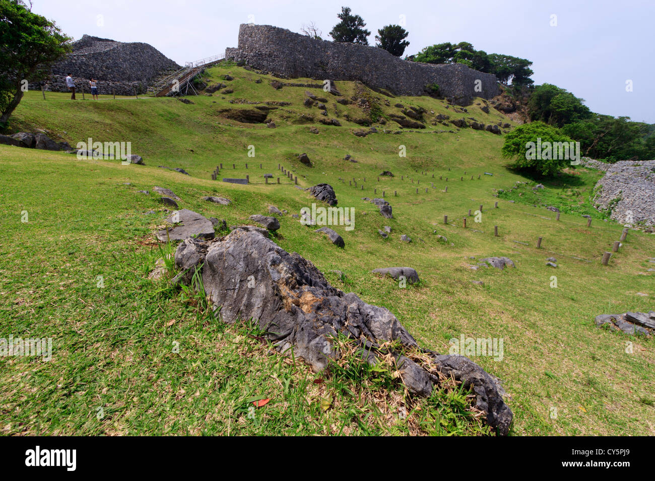 The tall stone walls are all that remain of Nakijin Castle, a 14th ...