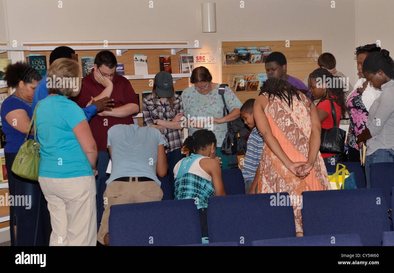 group of people praying Stock Photo - Alamy