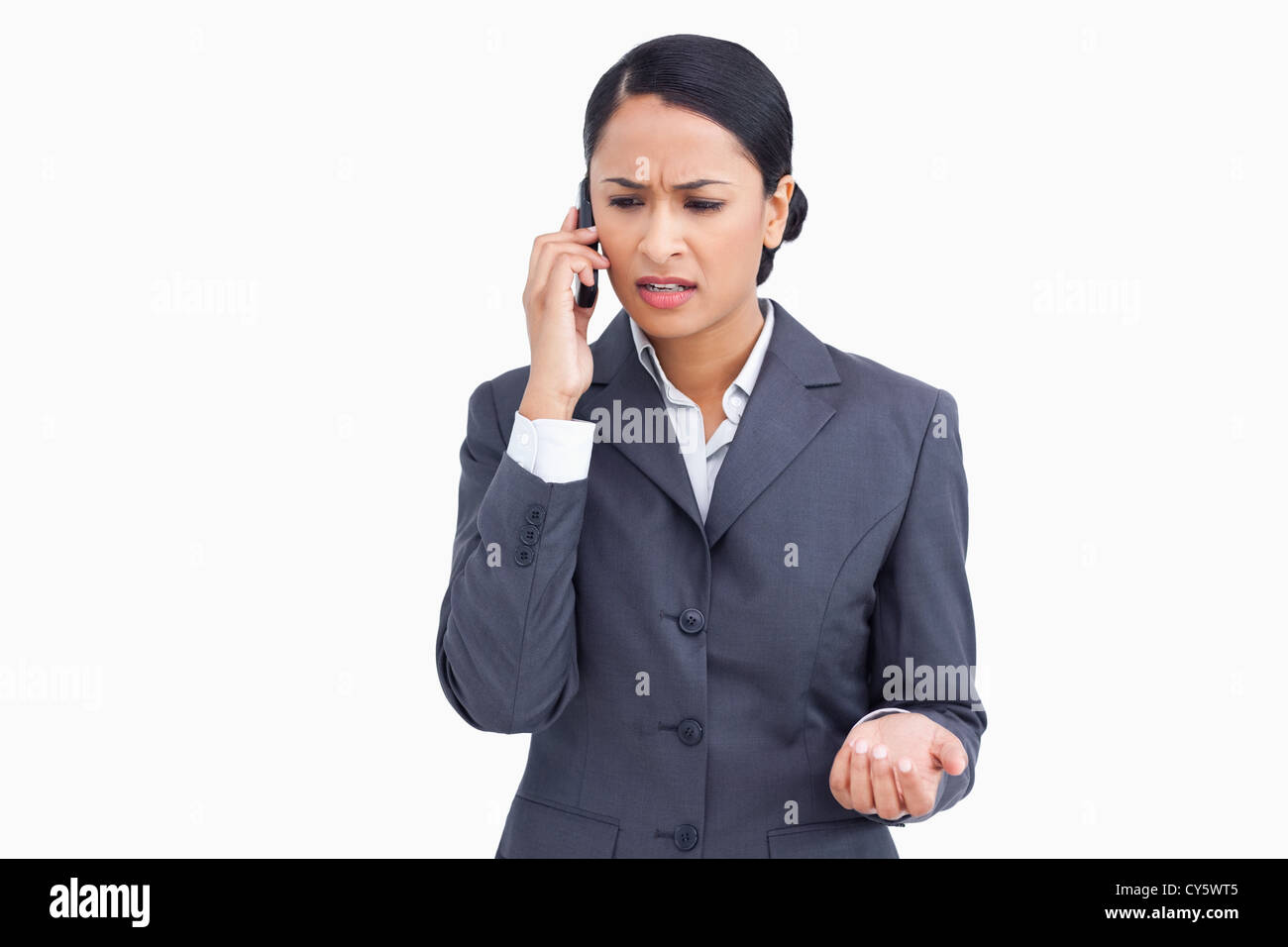 Close up of angry saleswoman in phone conversation Stock Photo - Alamy