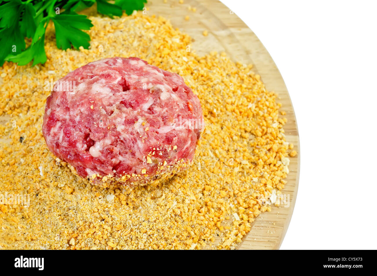 Crude homemade meatball, bread crumbs, a bunch of green parsley on a ...