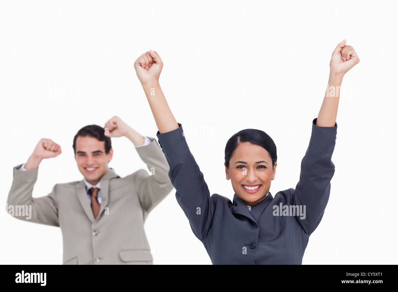 Cheering saleswoman with colleague behind her Stock Photo - Alamy