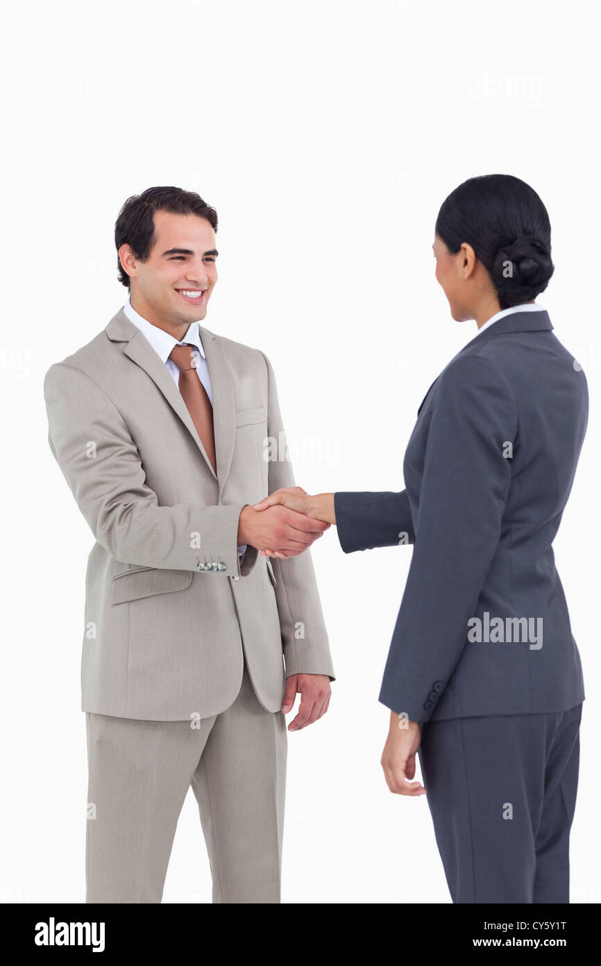 Business people standing shaking Cut Out Stock Images & Pictures - Alamy