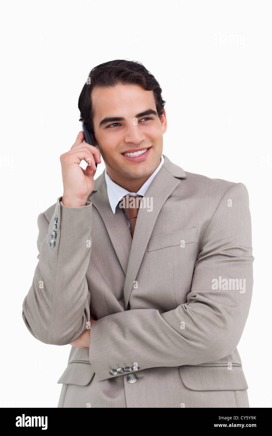 Smiling salesman on his cellphone Stock Photo - Alamy