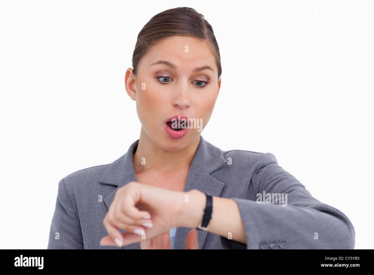 Surprised businesswoman checking her watch Stock Photo - Alamy