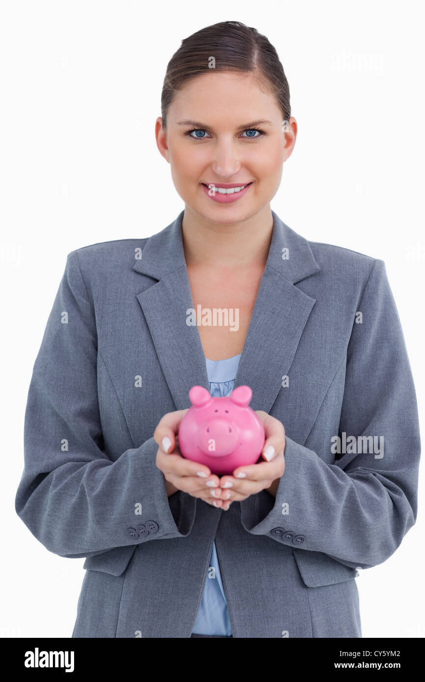 Smiling bank clerk holding piggy-bank Stock Photo - Alamy