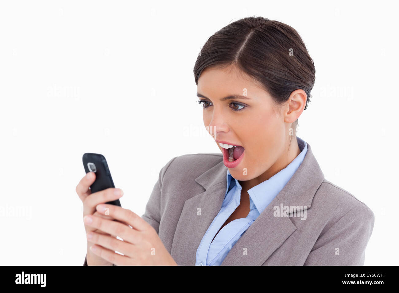 Close up of female entrepreneur surprised by text message Stock Photo ...