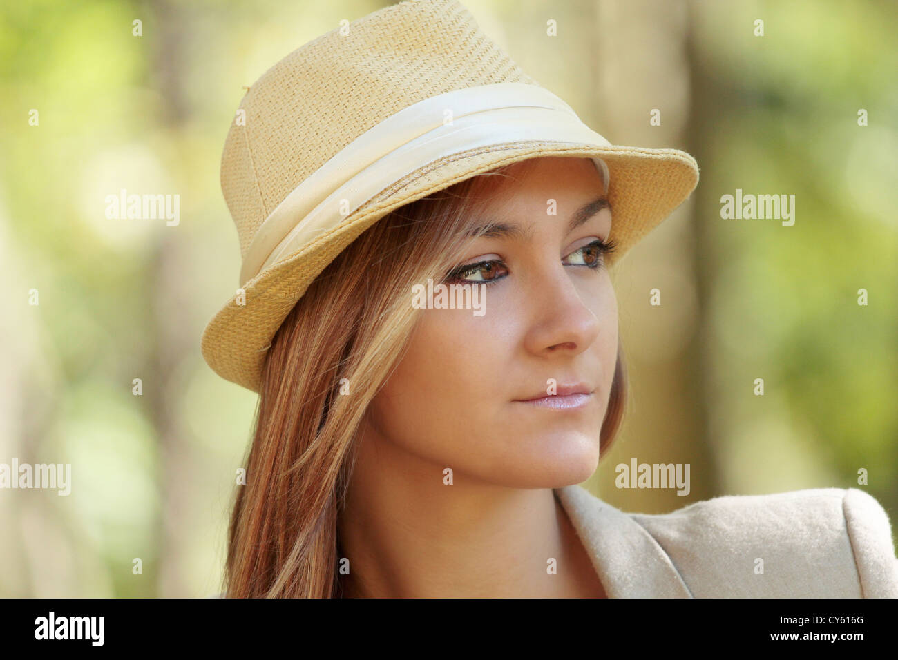 Stylish young model wearing a hat Stock Photo - Alamy