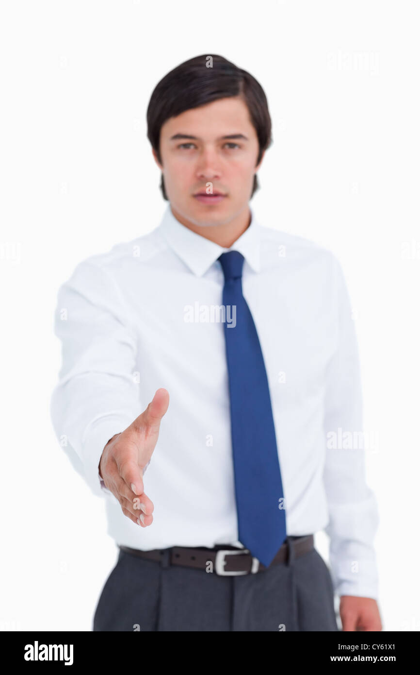 Hand offered by young tradesman Stock Photo - Alamy
