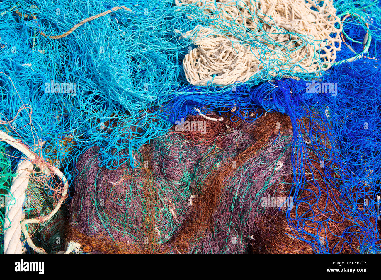 fishing nets pattern mess stacked at port in Mediterranean Stock Photo ...