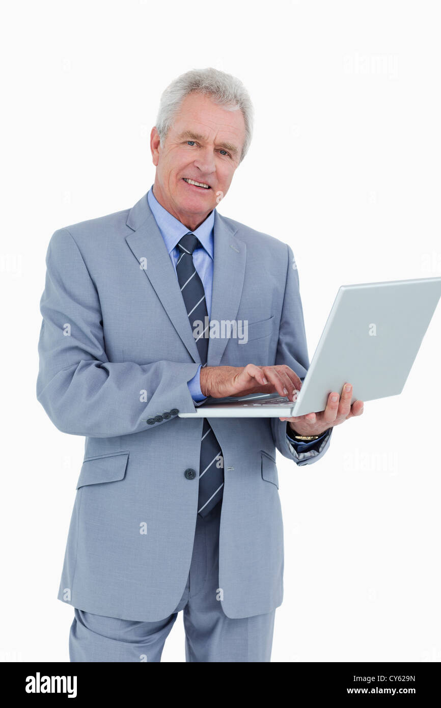 Smiling mature tradesman with his notebook Stock Photo - Alamy