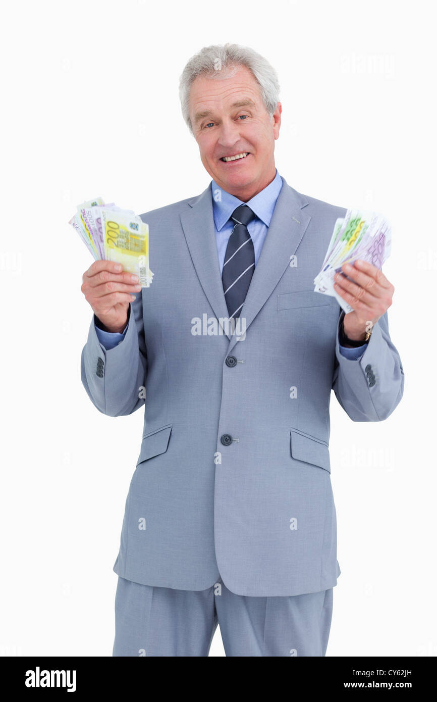 Mature businessman presenting his earnings Stock Photo - Alamy