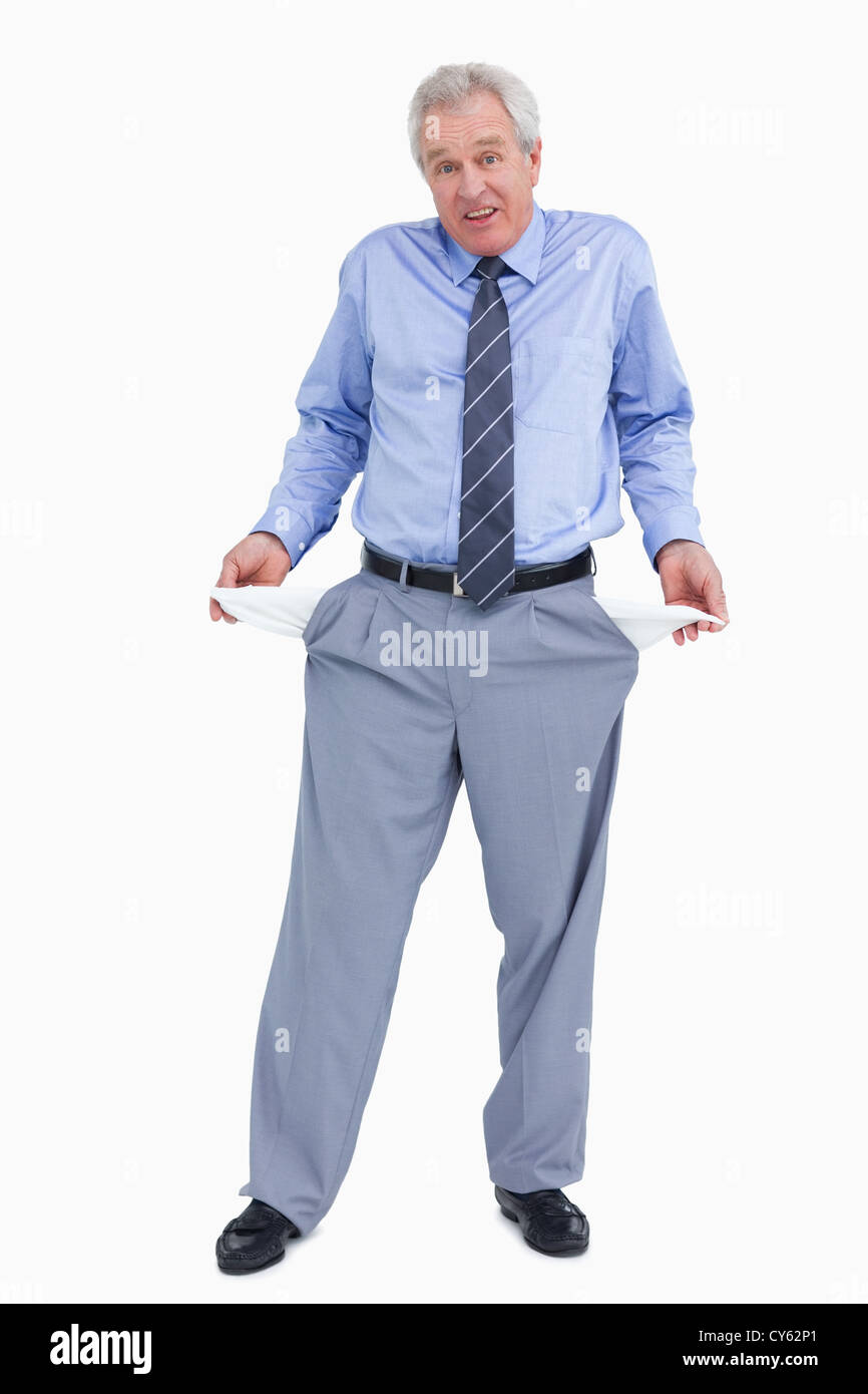 Clueless tradesman showing his empty pockets Stock Photo - Alamy