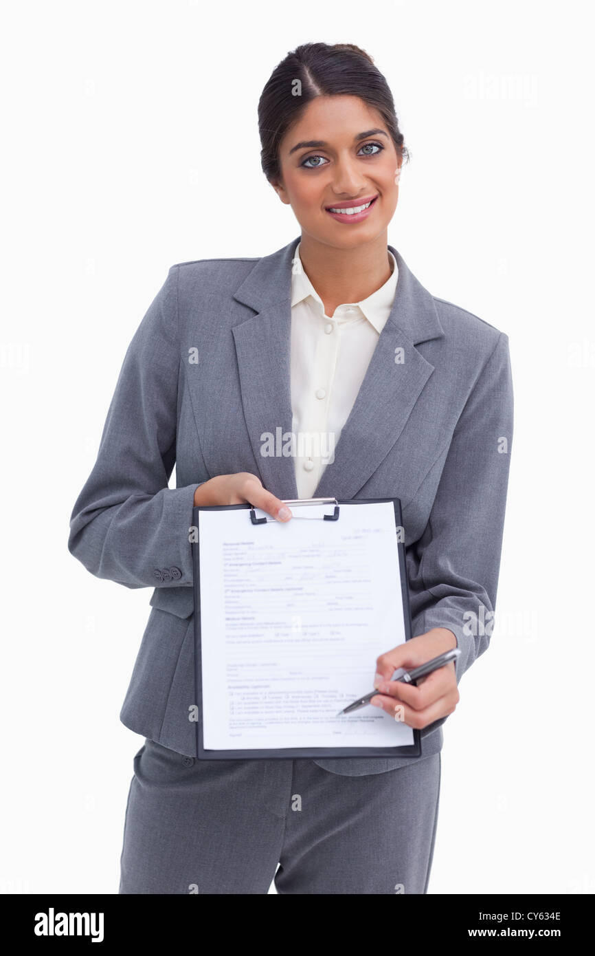 Smiling female entrepreneur asking for signature Stock Photo - Alamy