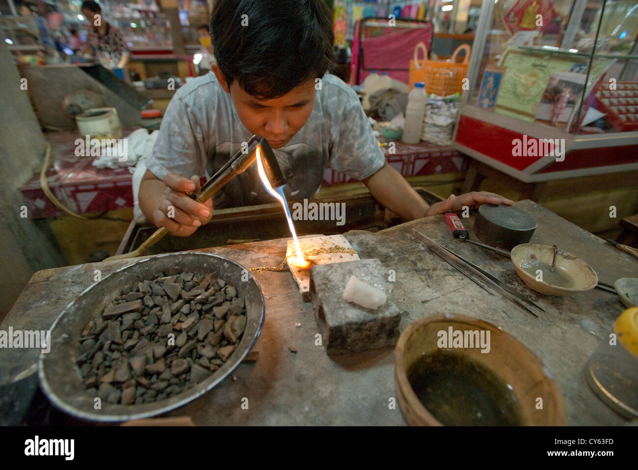 A young jeweller at work in Sisophon, Cambodia Stock Photo - Alamy