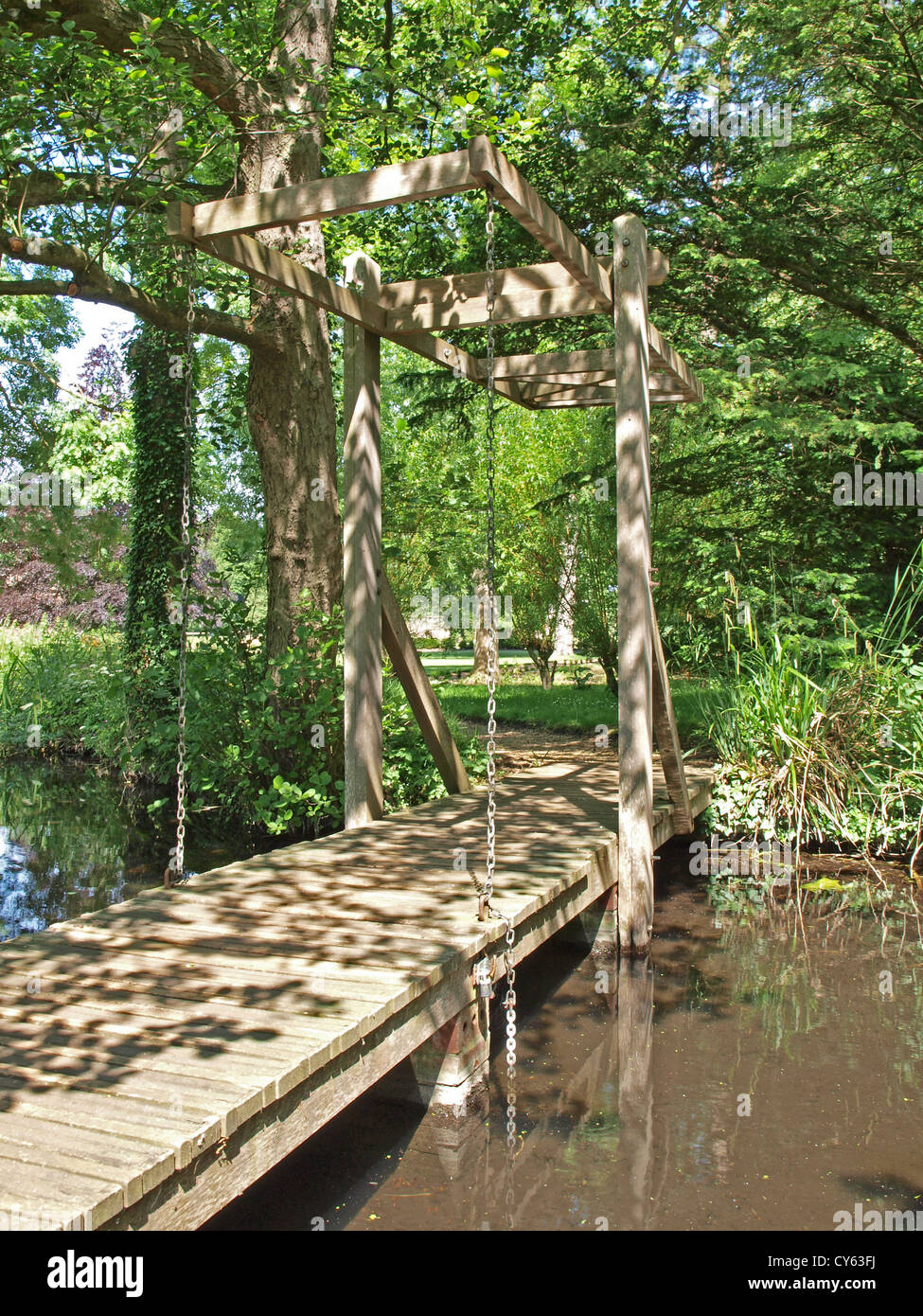 Counter lever bridge over a shallow river Stock Photo - Alamy