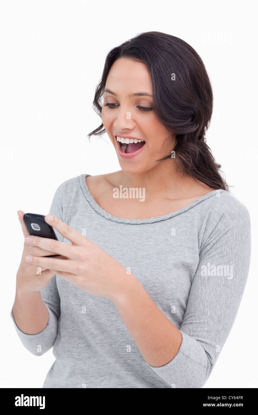 Close up of happy woman reading text message Stock Photo - Alamy