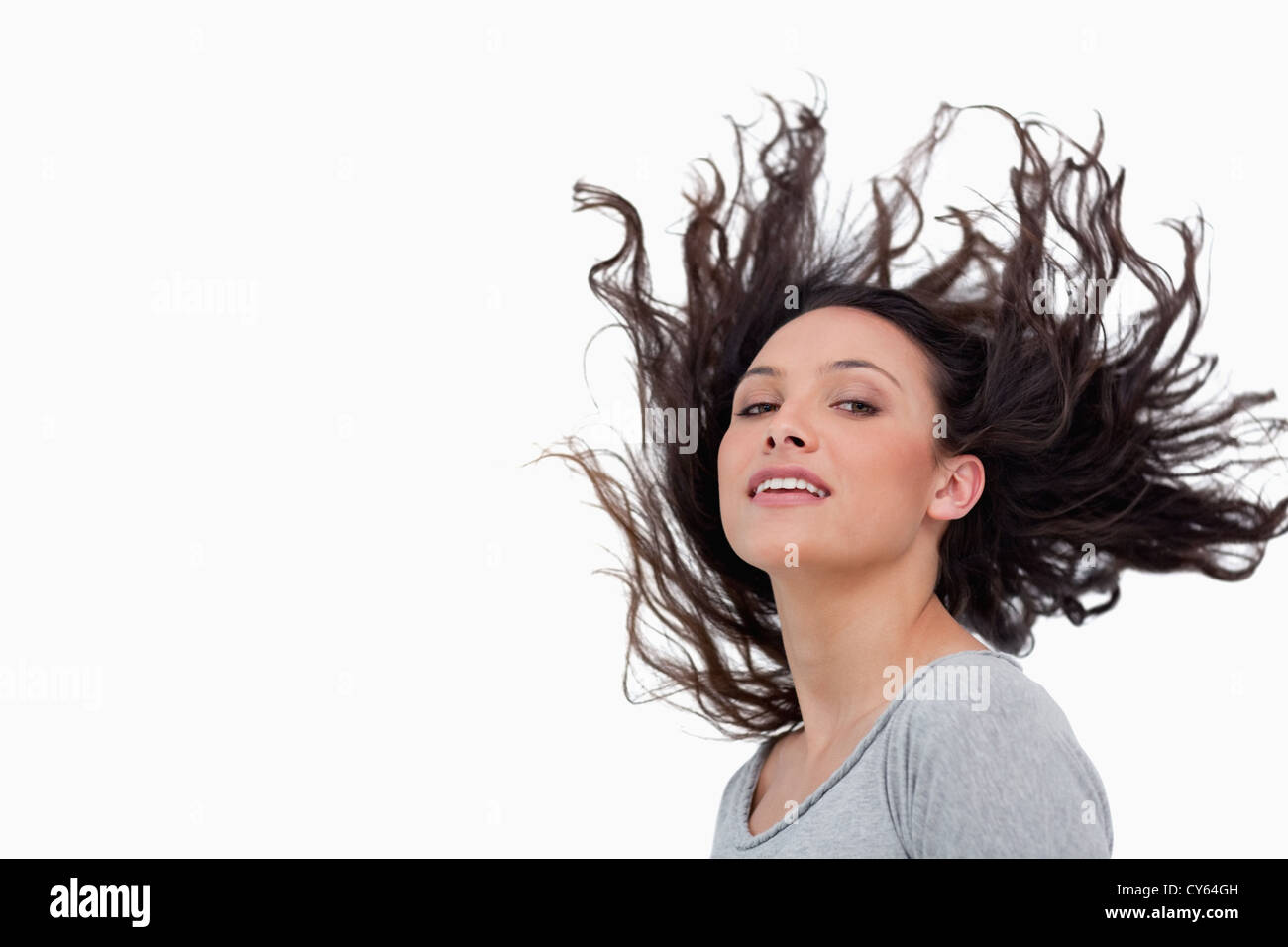 Sensual looking woman flipping her hair Stock Photo - Alamy
