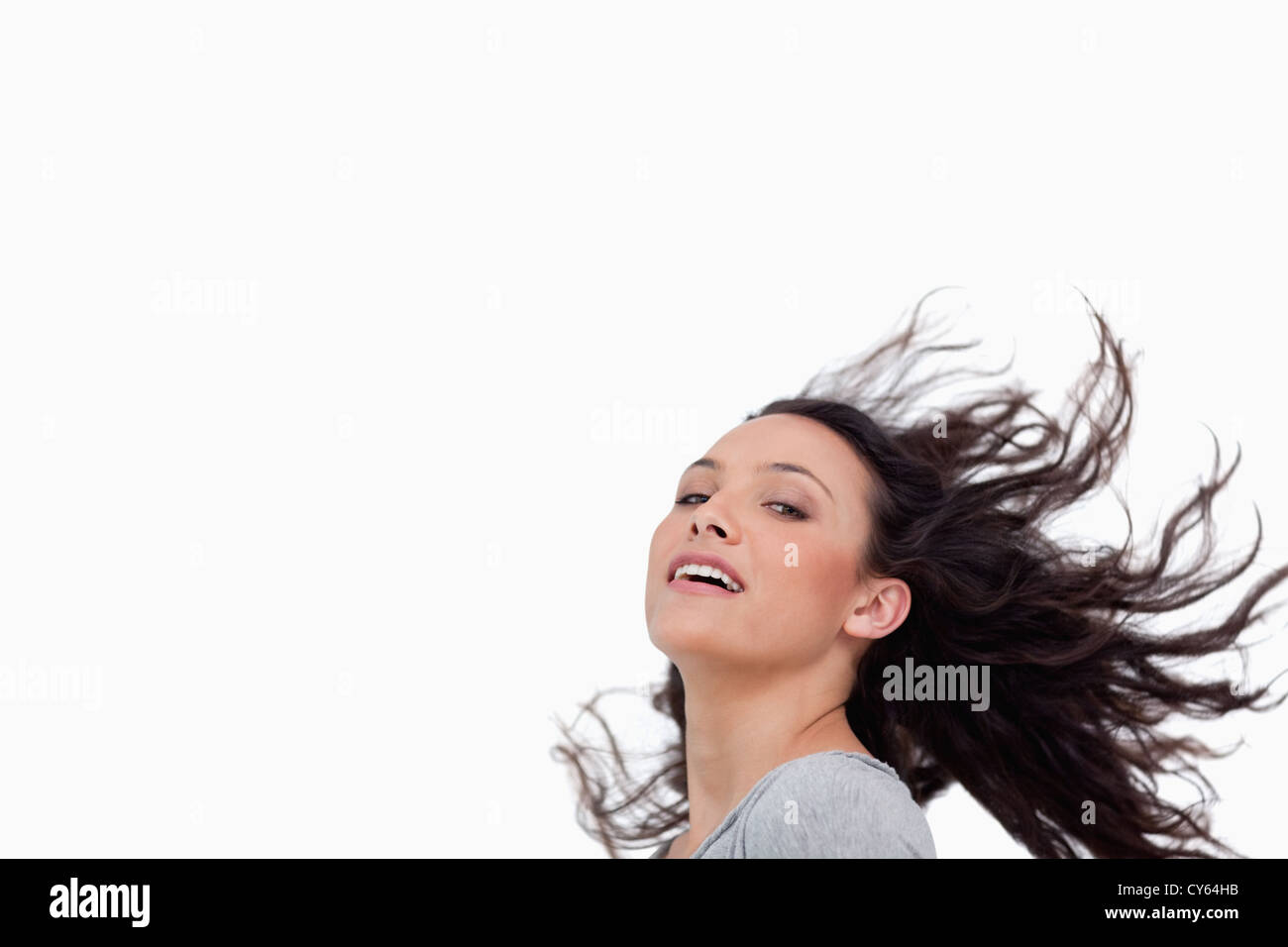 Young woman with her hair in motion Stock Photo - Alamy