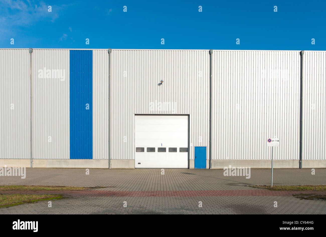 modern industrial unit with roller door Stock Photo - Alamy