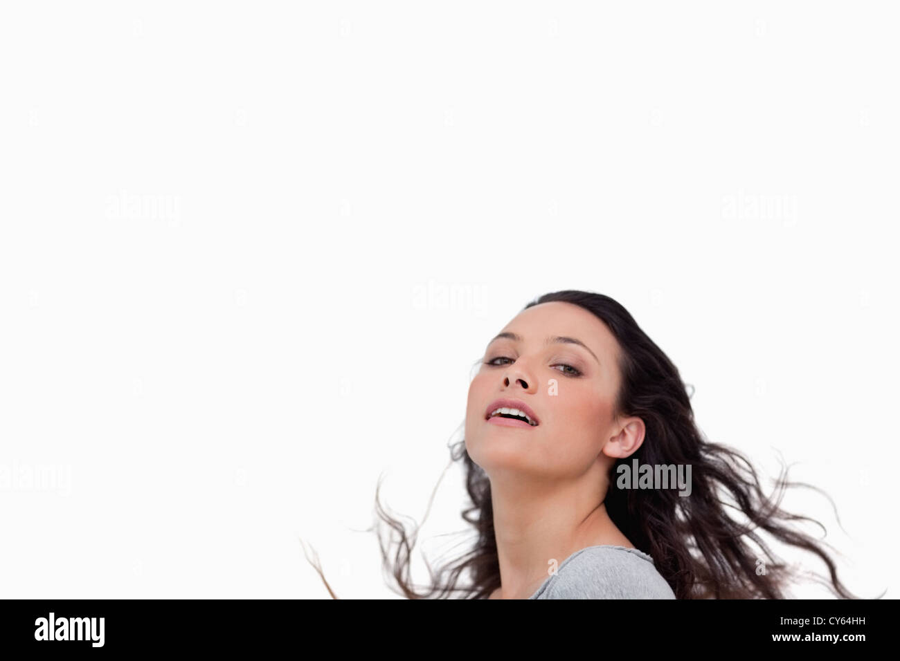 Sensual looking young woman flipping her hair Stock Photo - Alamy