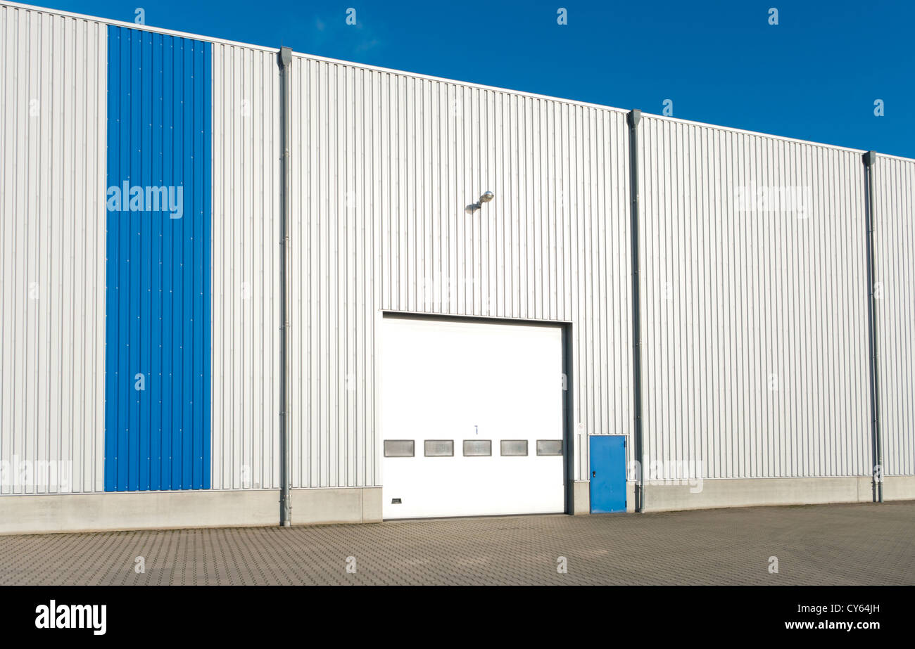 modern industrial unit with roller door Stock Photo - Alamy