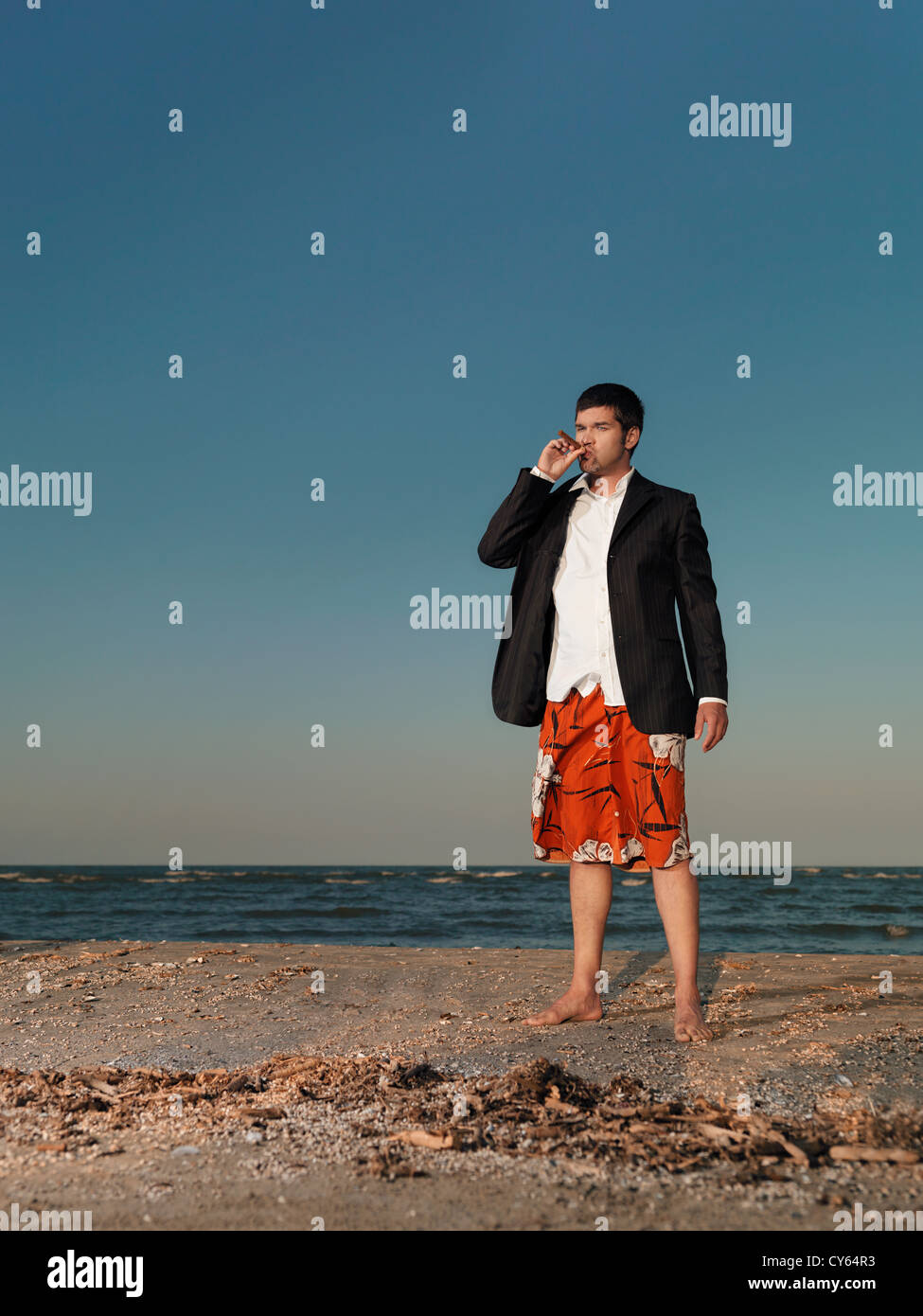 Hand cigar beach hi-res stock photography and images - Alamy