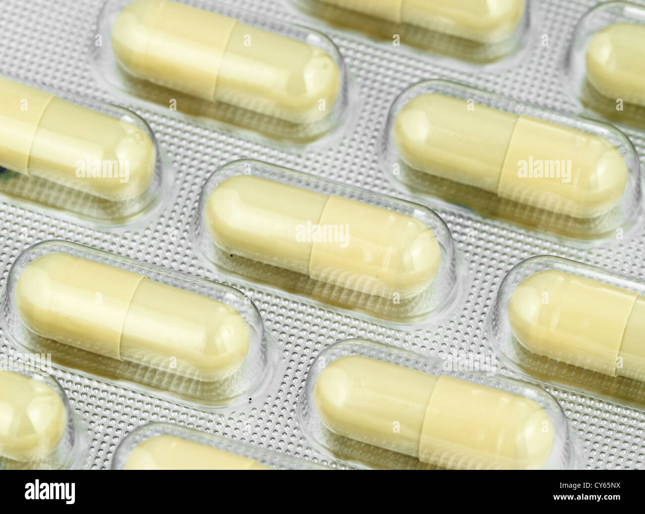 Yellow full capsule drug hi-res stock photography and images - Alamy