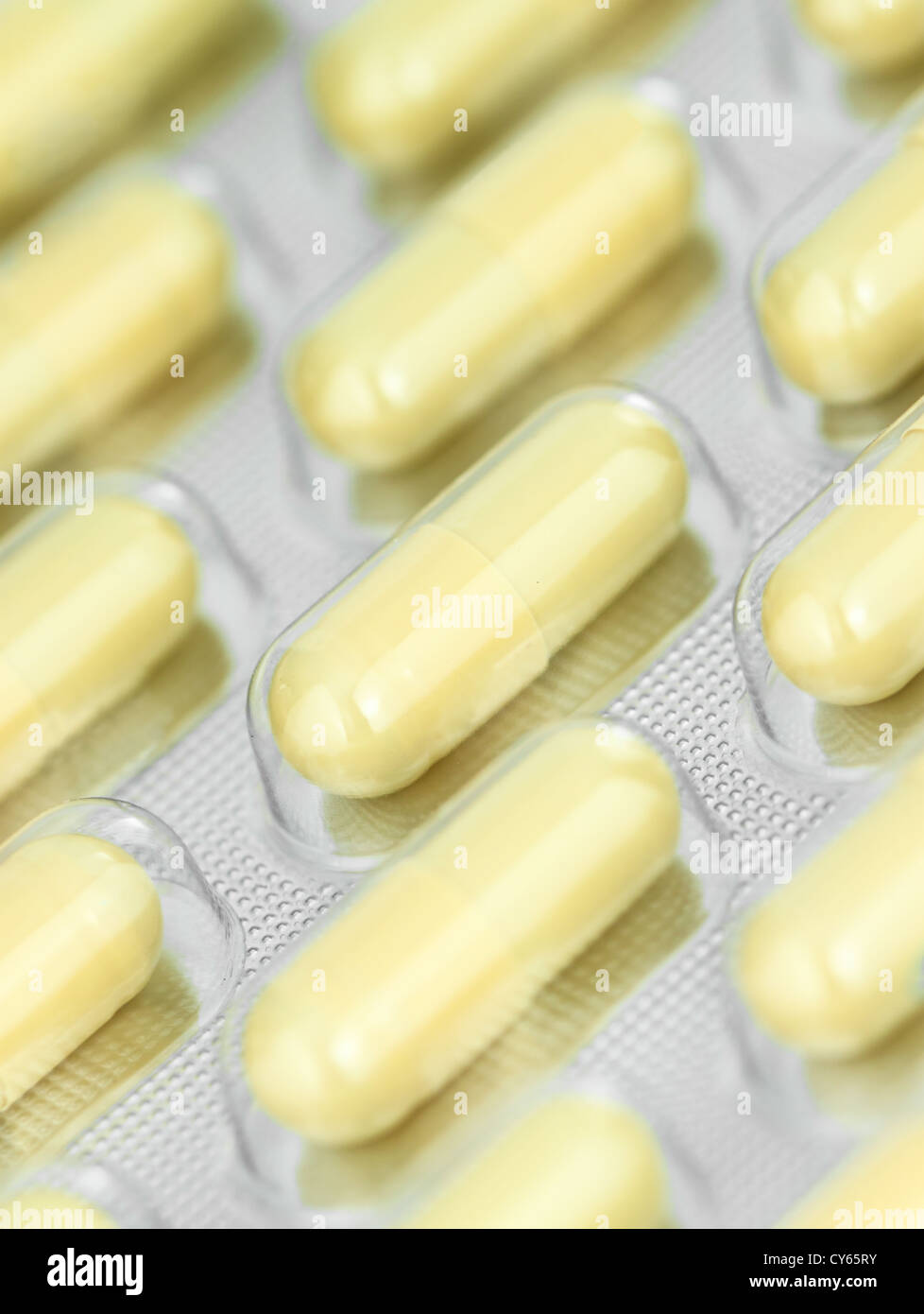 pack of yellow pills, close-up Stock Photo - Alamy
