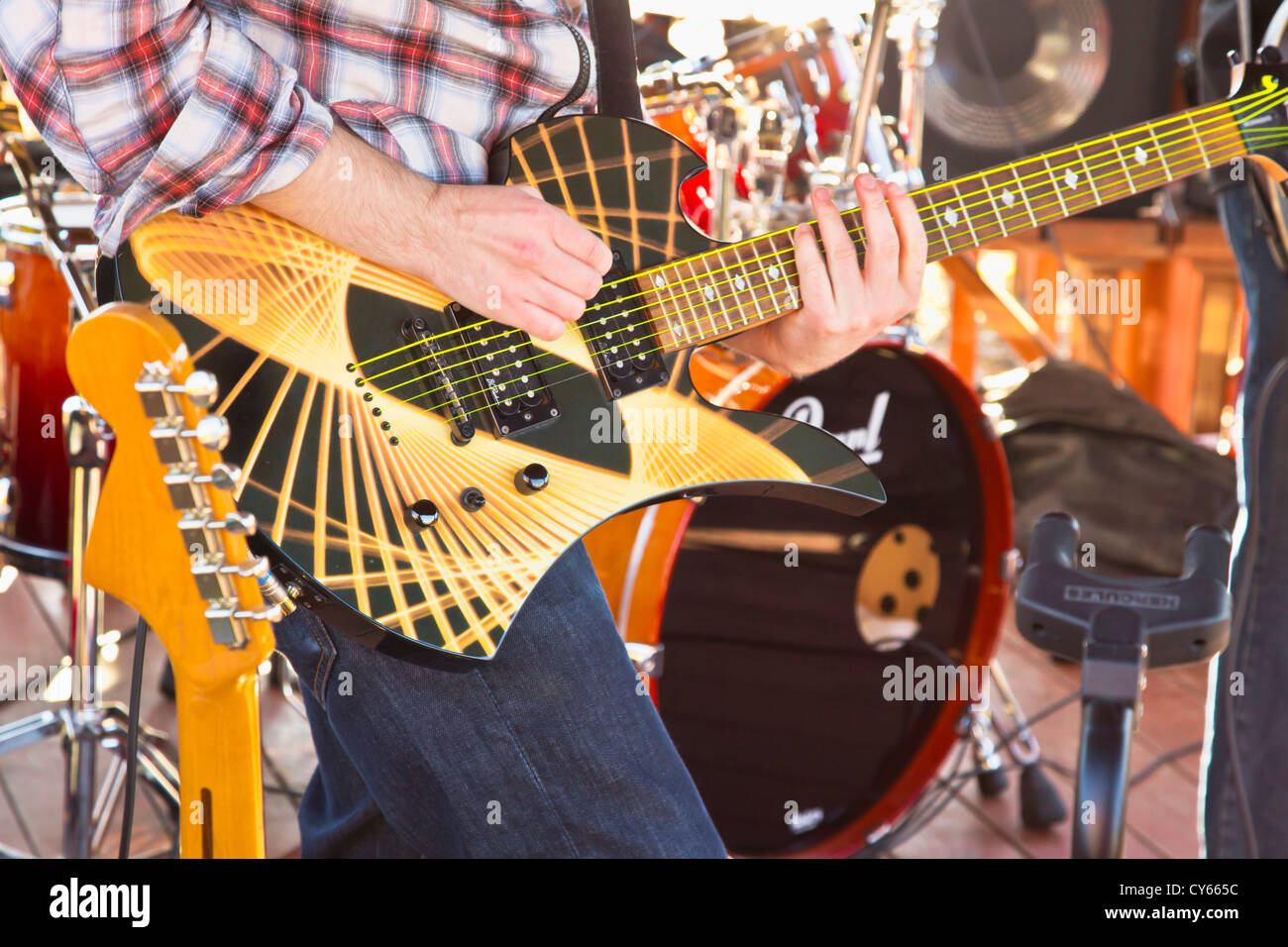 A ROCK BAND MEMBER PLAYING HIS GUITAR IN DERBYSHIRE ENGLAND Stock Photo ...