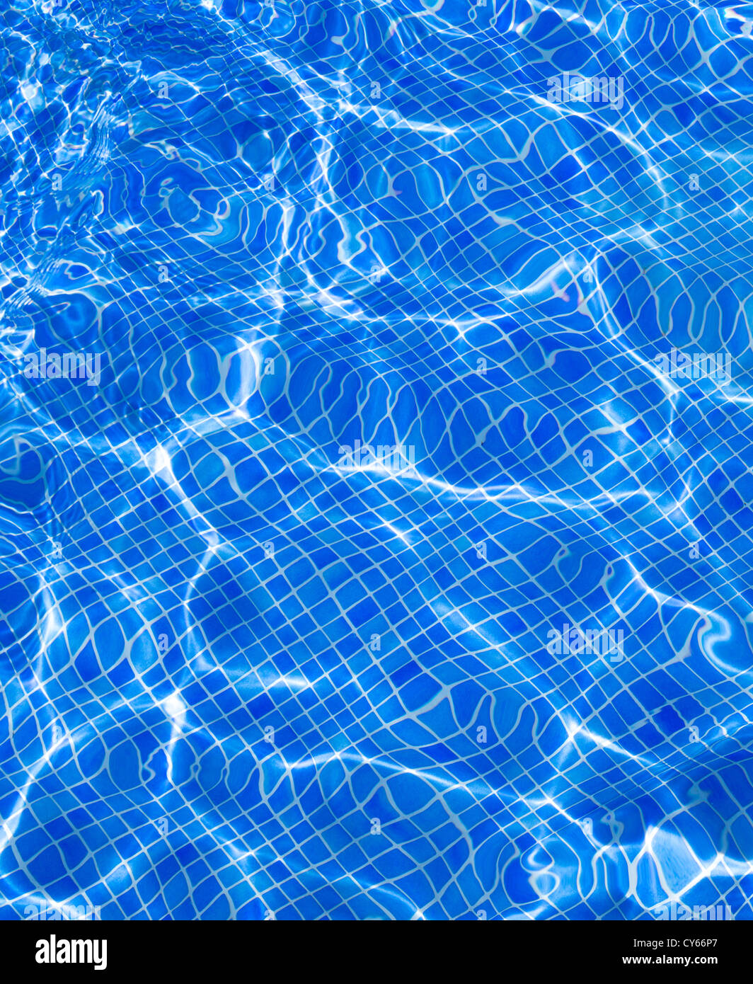 Blue tiles pool with ripple water reflection as a summer background ...