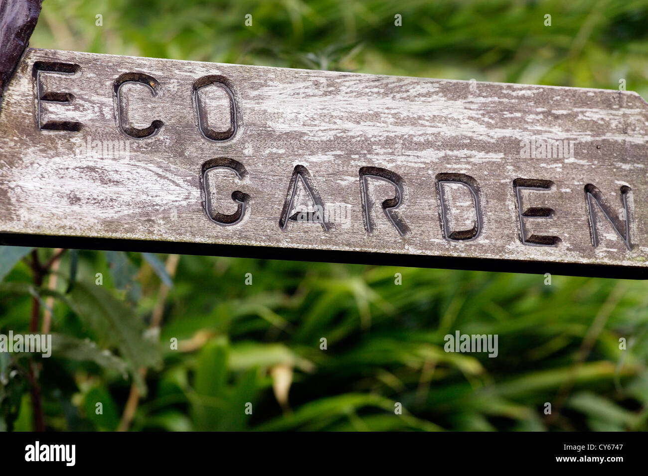 A rustic wooden sign denoting an Eco Garden Stock Photo - Alamy