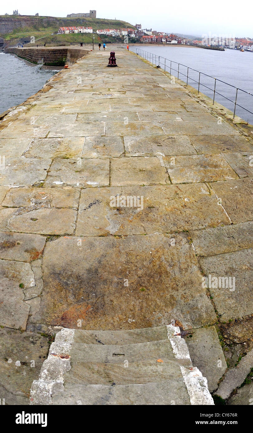 Large stone cut to form the old harbour wall and quay to the fishing ...